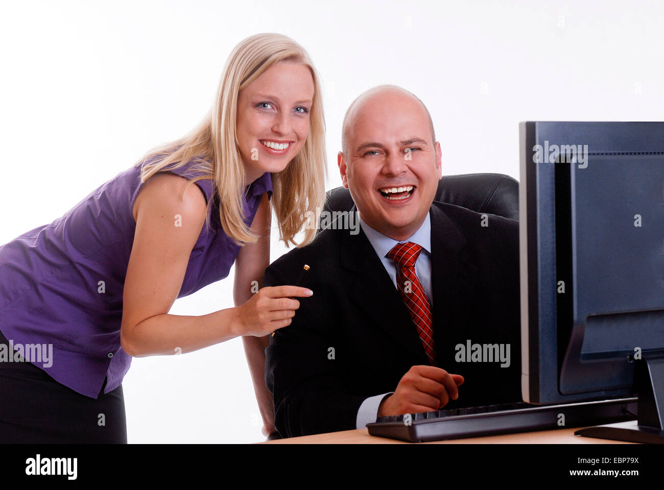 two business people working together on personal computer Stock Photo ...