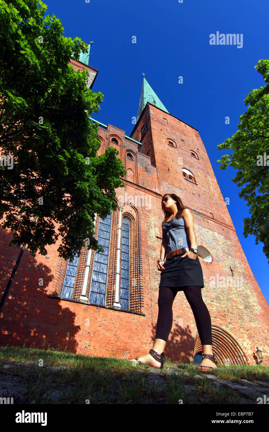 young woman in front of Luebeck Cathedral, Germany, Schleswig-Holstein ...