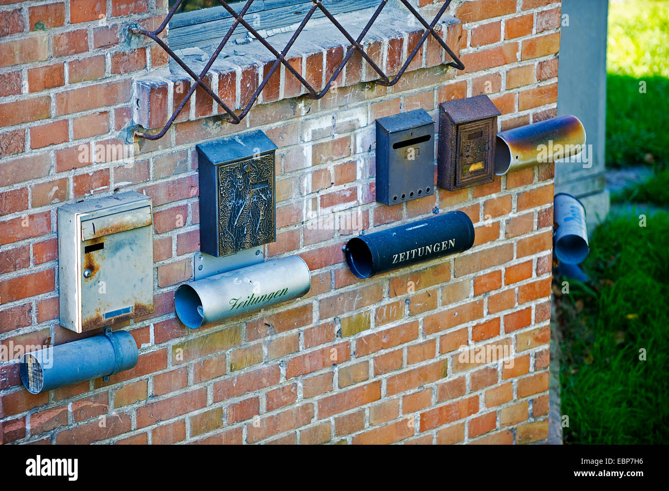 rusty mailboxes and newspaper tubes, Germany Stock Photo - Alamy