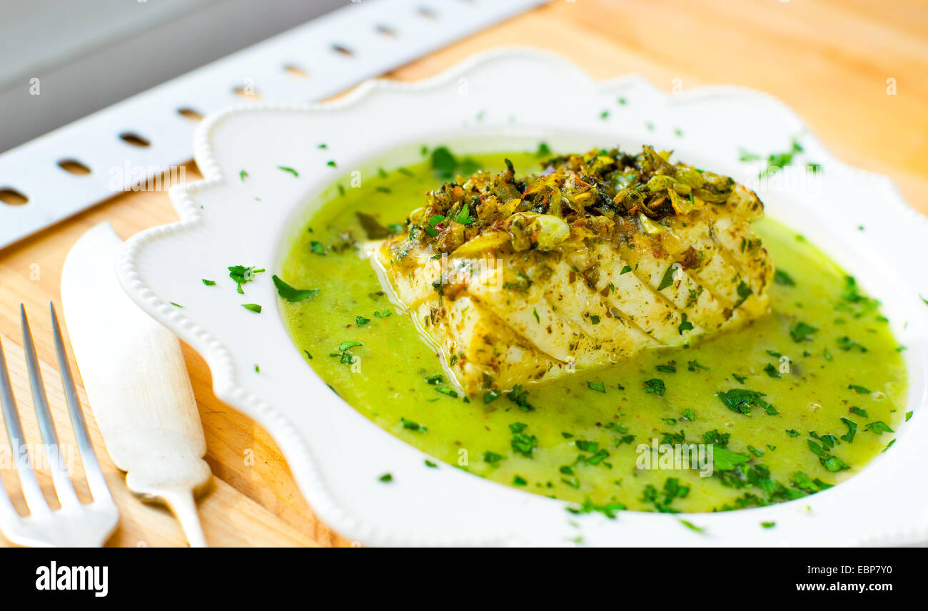 Cod in green sauce (Bacalao en salsa verde). Basque cuisine Stock Photo ...