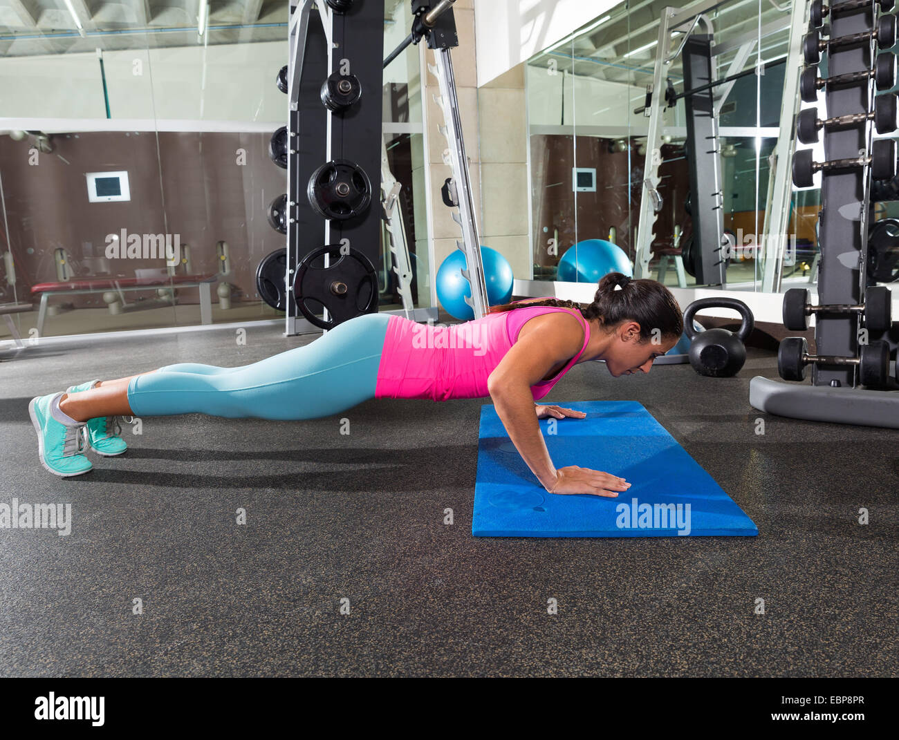 brunette woman at gym push up push-up workout exercise Stock Photo - Alamy