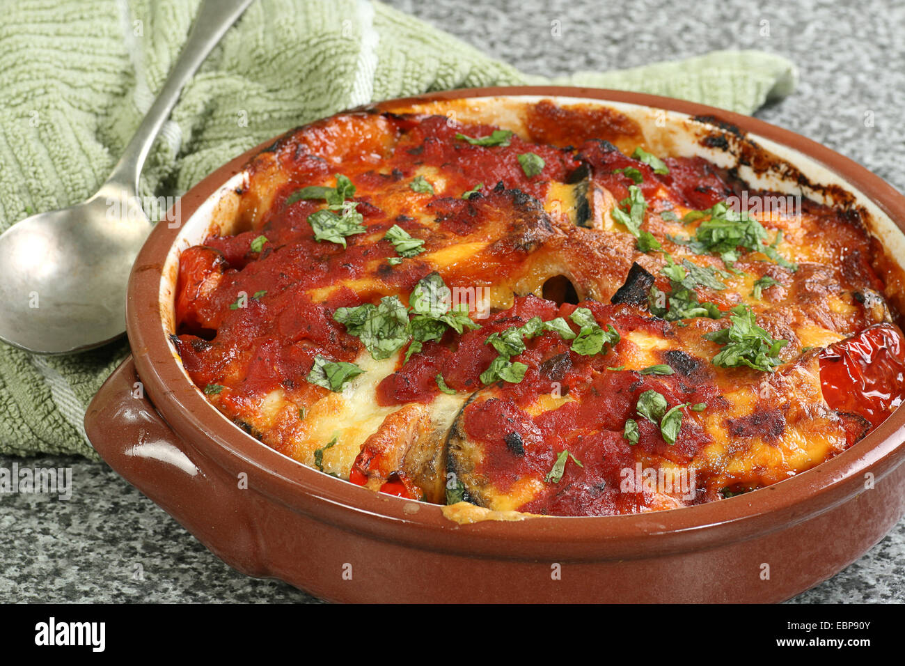 aubergine redpeppers and mozarella cheese baked in a terracotta dish ...