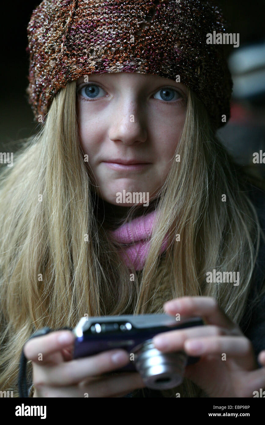 Young pretty girl with a compact digital camera Stock Photo - Alamy