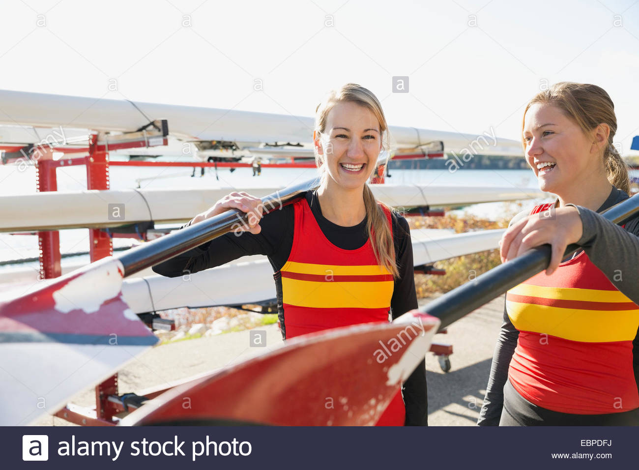Smiling holding oars sport hi-res stock photography and images - Alamy