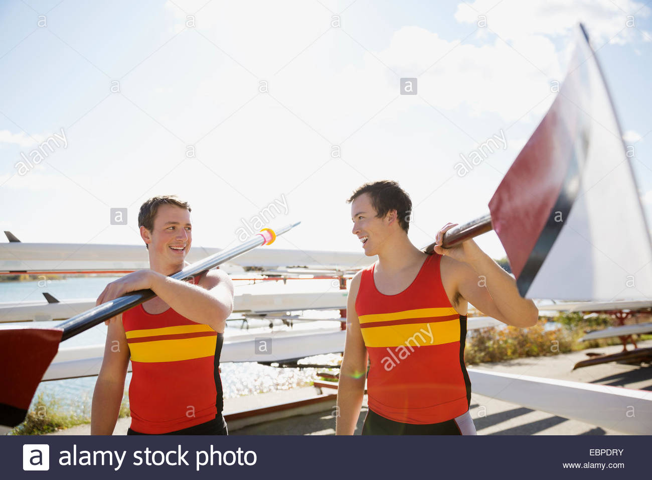 Two men standing up rowing boat hi-res stock photography and images - Alamy