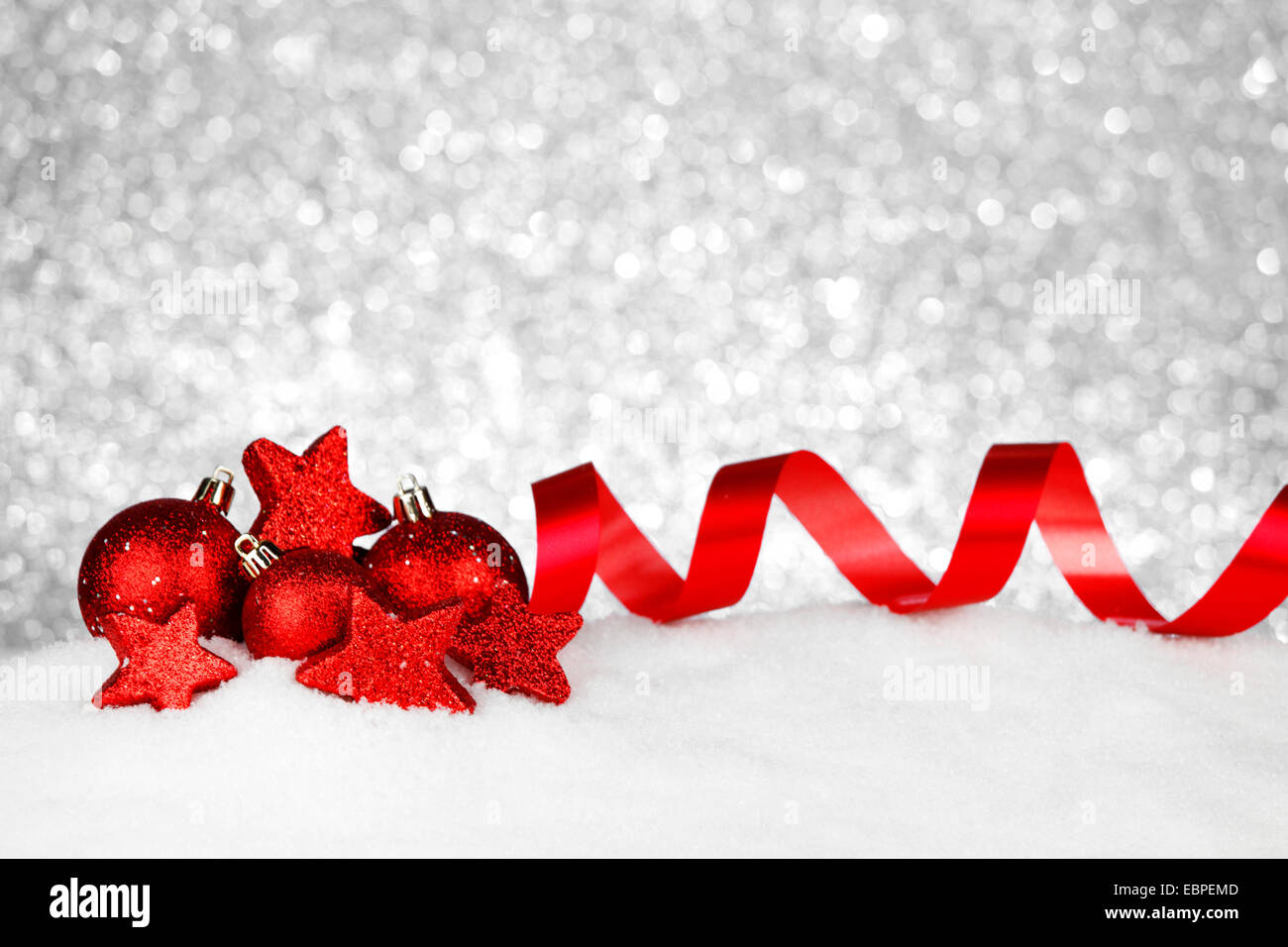 Beautiful red christmas decor on snow Stock Photo - Alamy