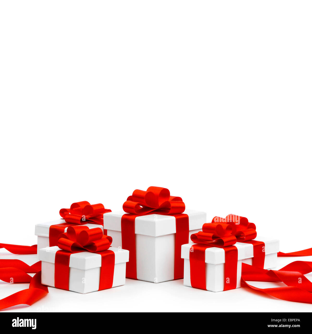 White gift boxes with red ribbon bows isolated on white background ...