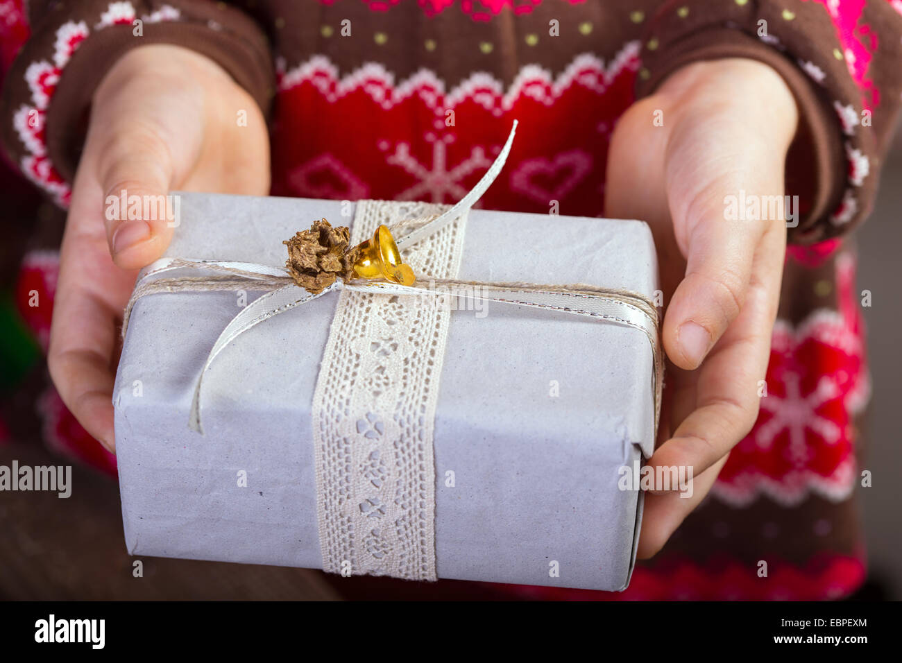 present in children's hands Stock Photo - Alamy