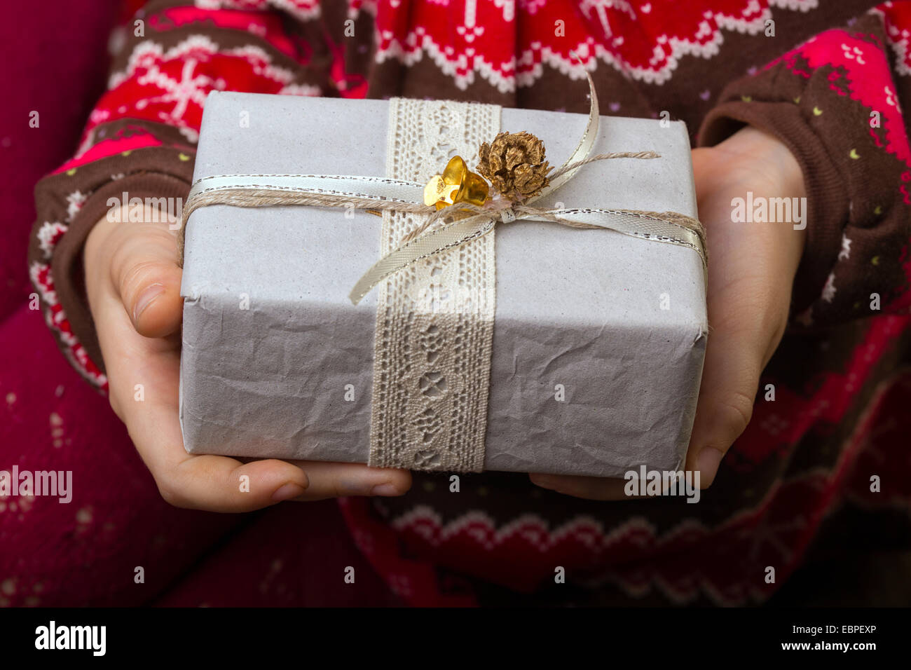present in children's hands Stock Photo - Alamy