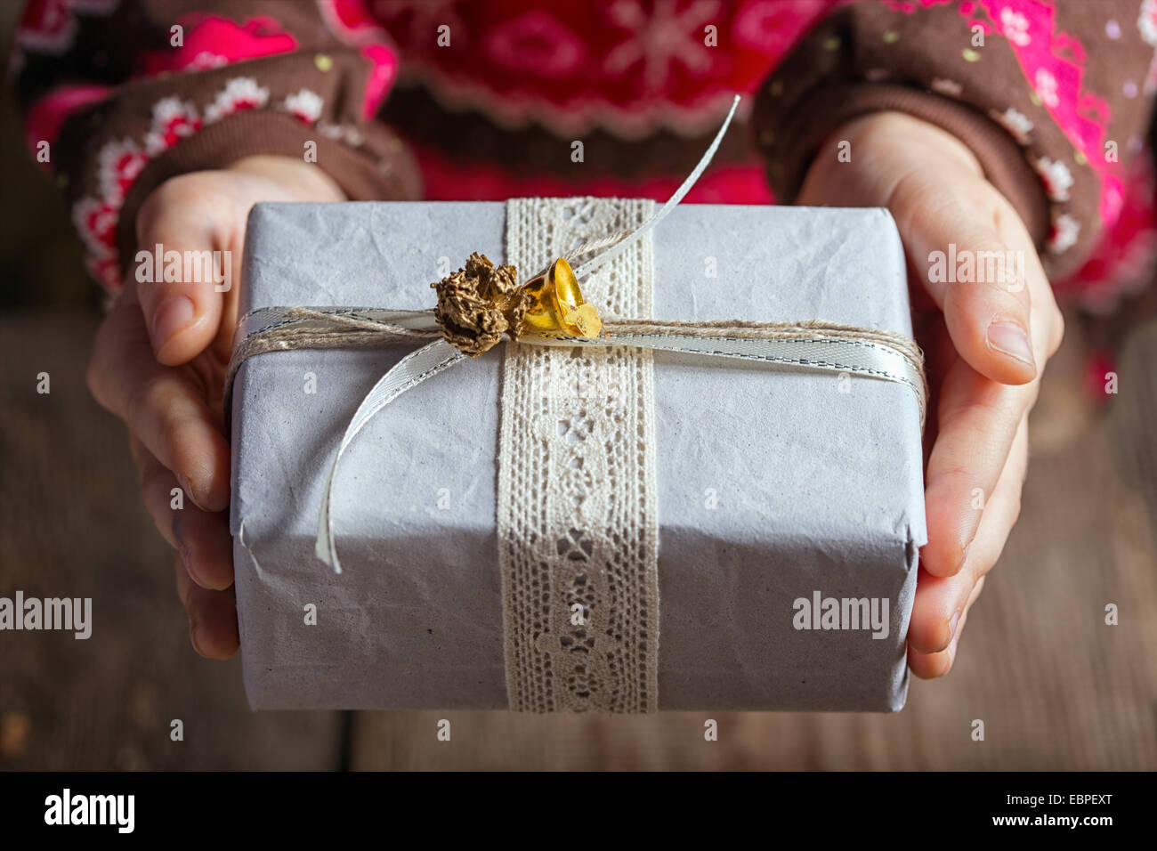 present in children's hands Stock Photo - Alamy