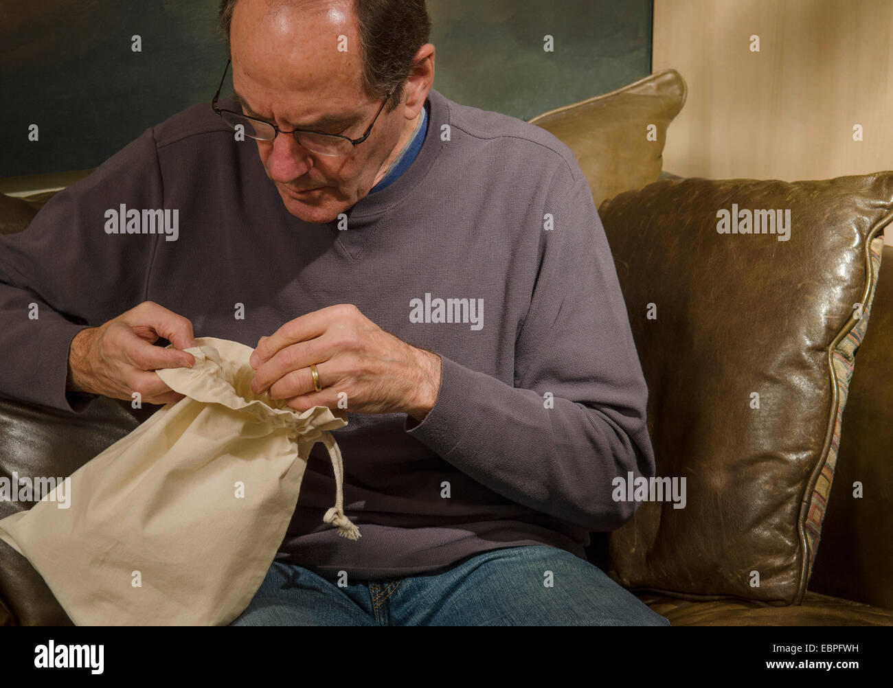 Reaching into bag hi-res stock photography and images - Alamy