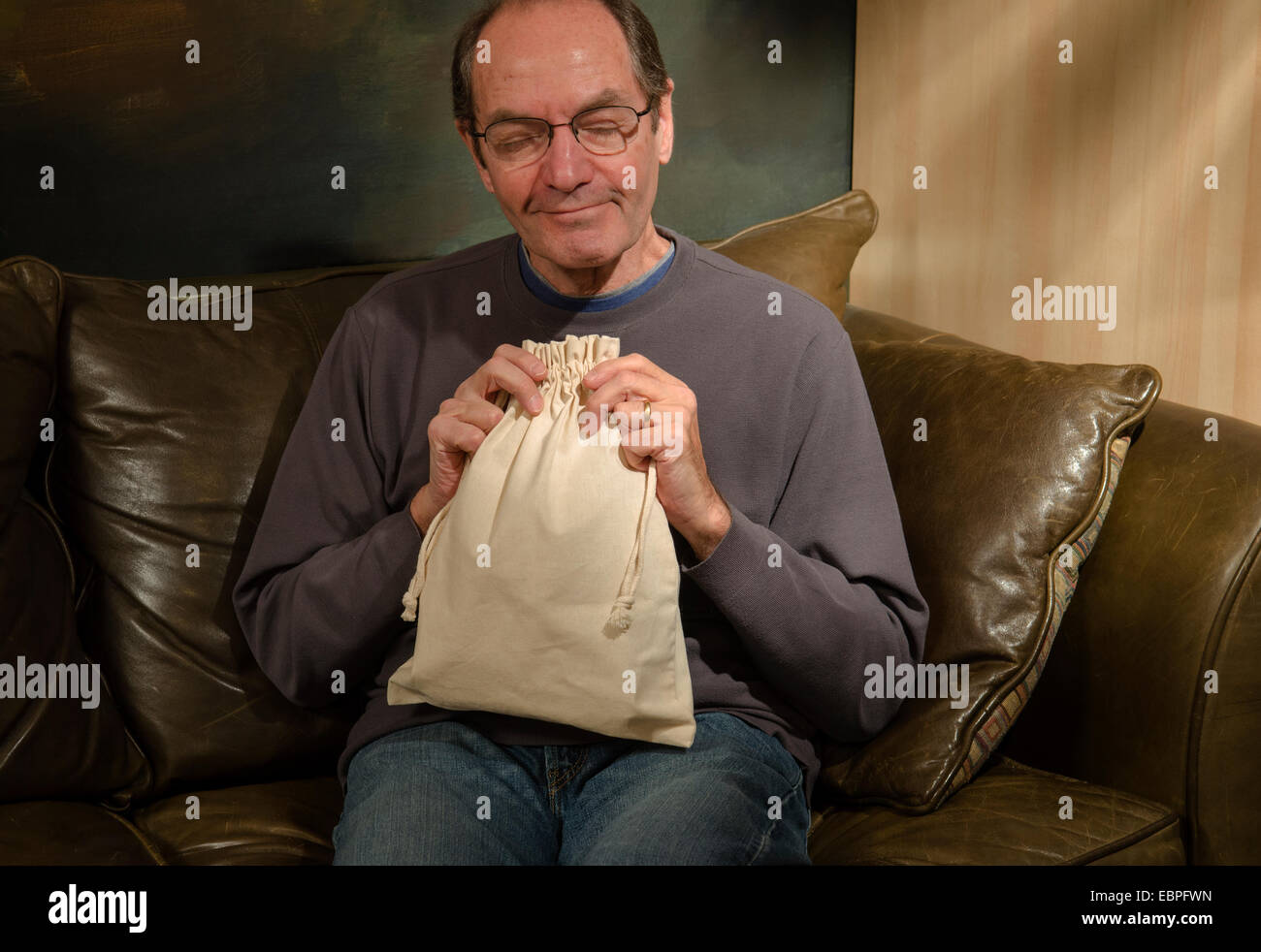 Pensive smiling man holding hi-res stock photography and images - Alamy