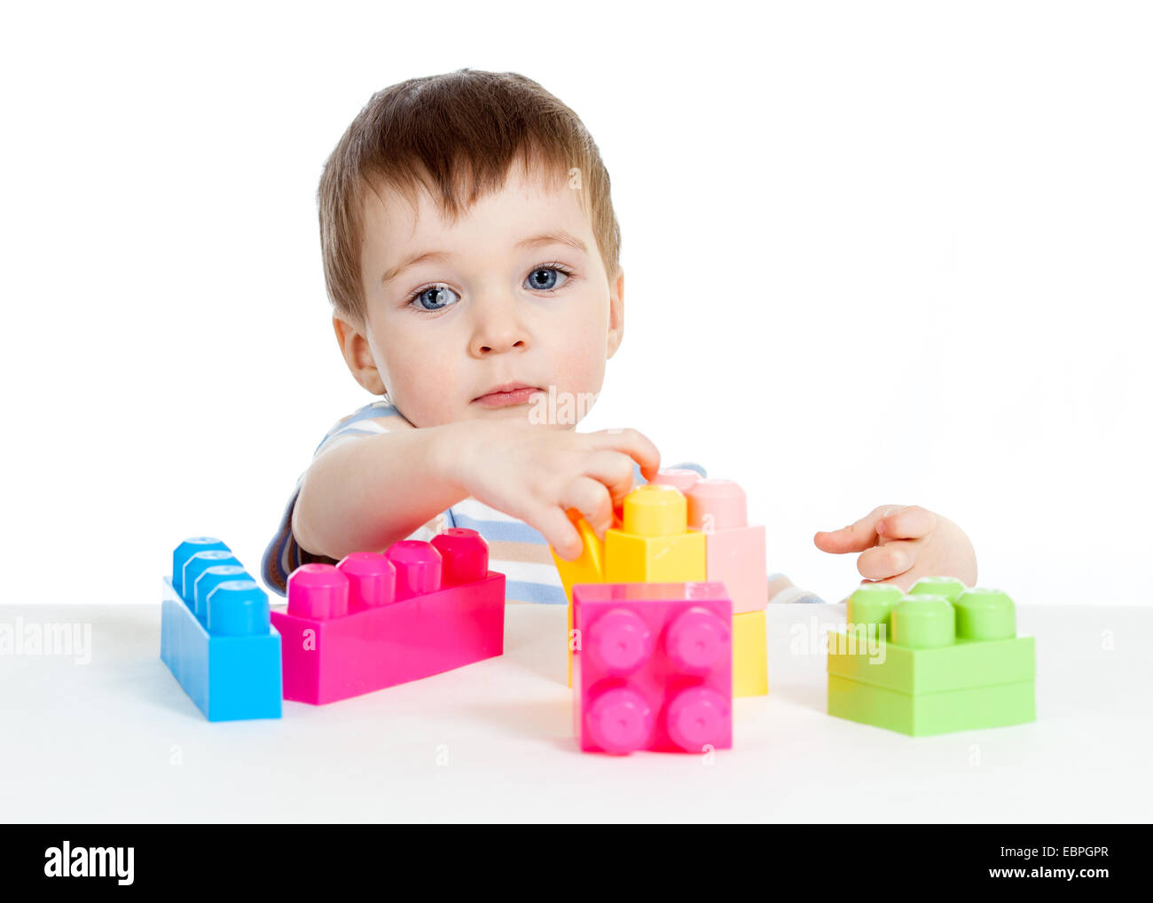 little child with construction set over white background Stock Photo ...