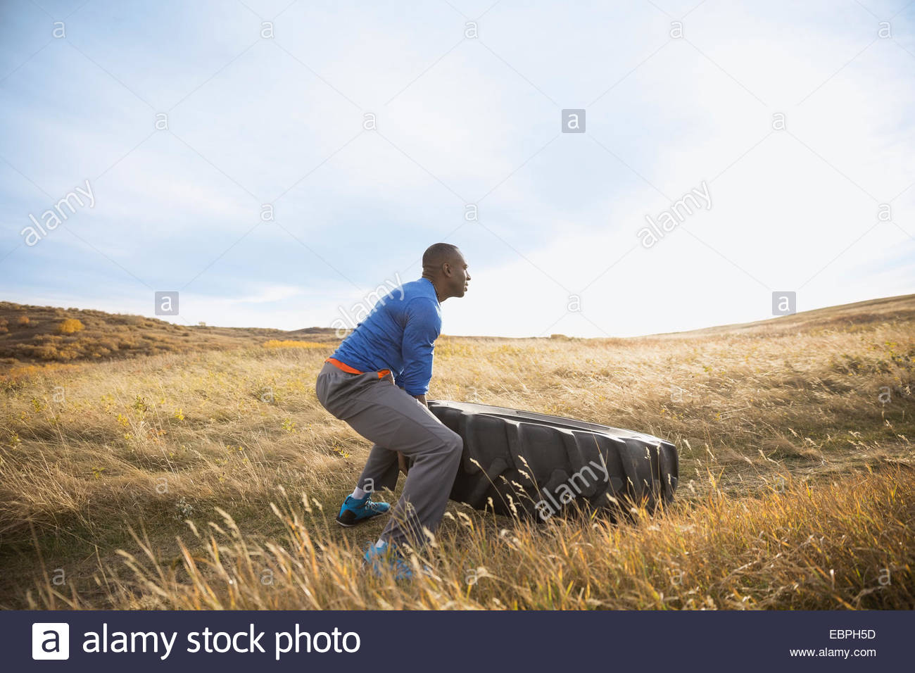 Man flipping tire hi-res stock photography and images - Alamy