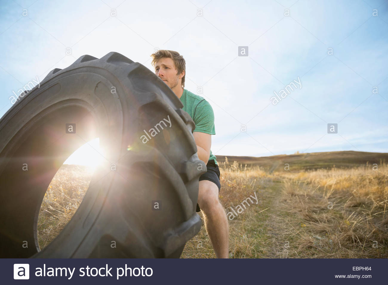 Man flipping tire hi-res stock photography and images - Alamy