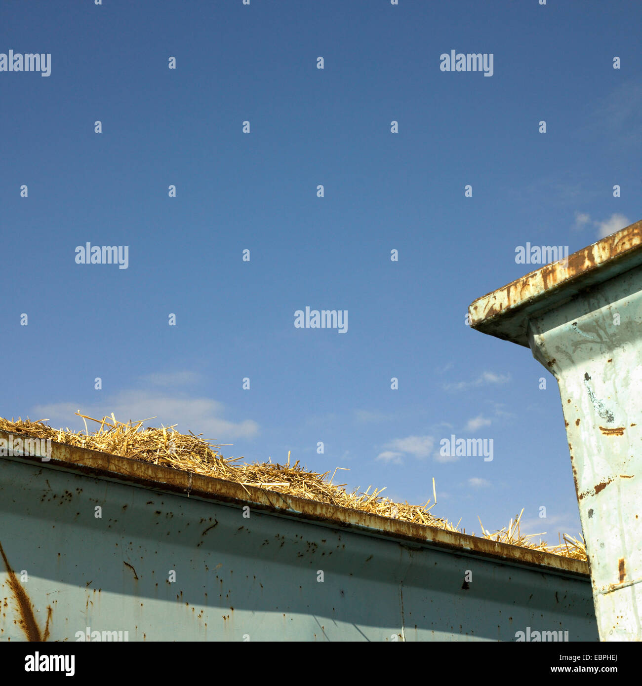 Old containers filled with hay Stock Photo - Alamy