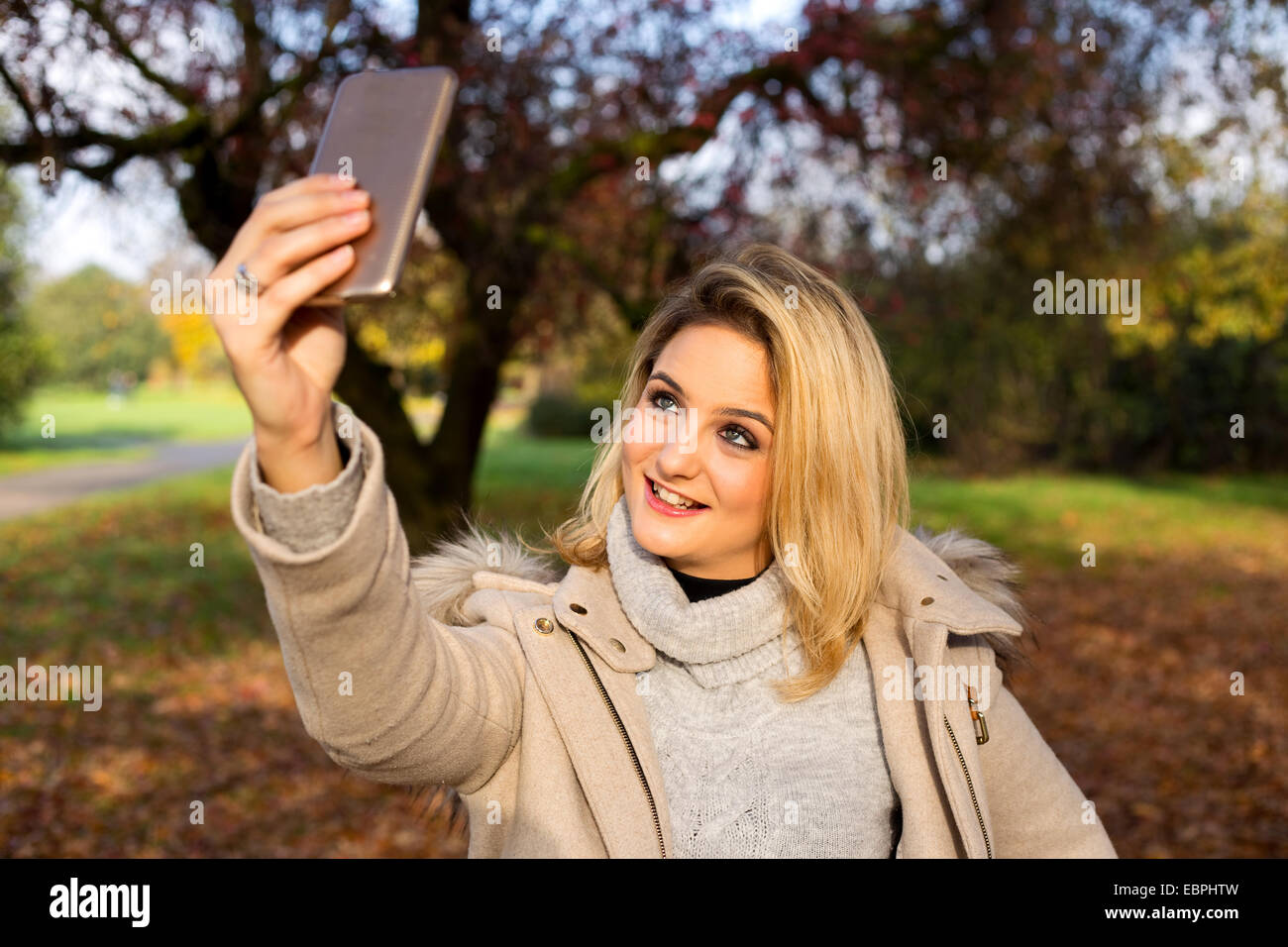 Beautiful blonde woman taking selfie hi-res stock photography and ...