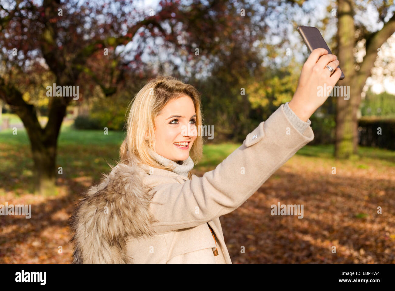 Beautiful blonde woman taking selfie hi-res stock photography and ...