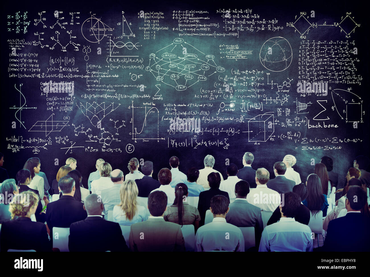 Multiethnic Group of People with Formula on Chalkboard Stock Photo - Alamy