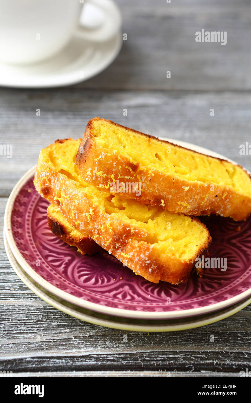 Two Slices of a tea cake, wooden background Stock Photo - Alamy