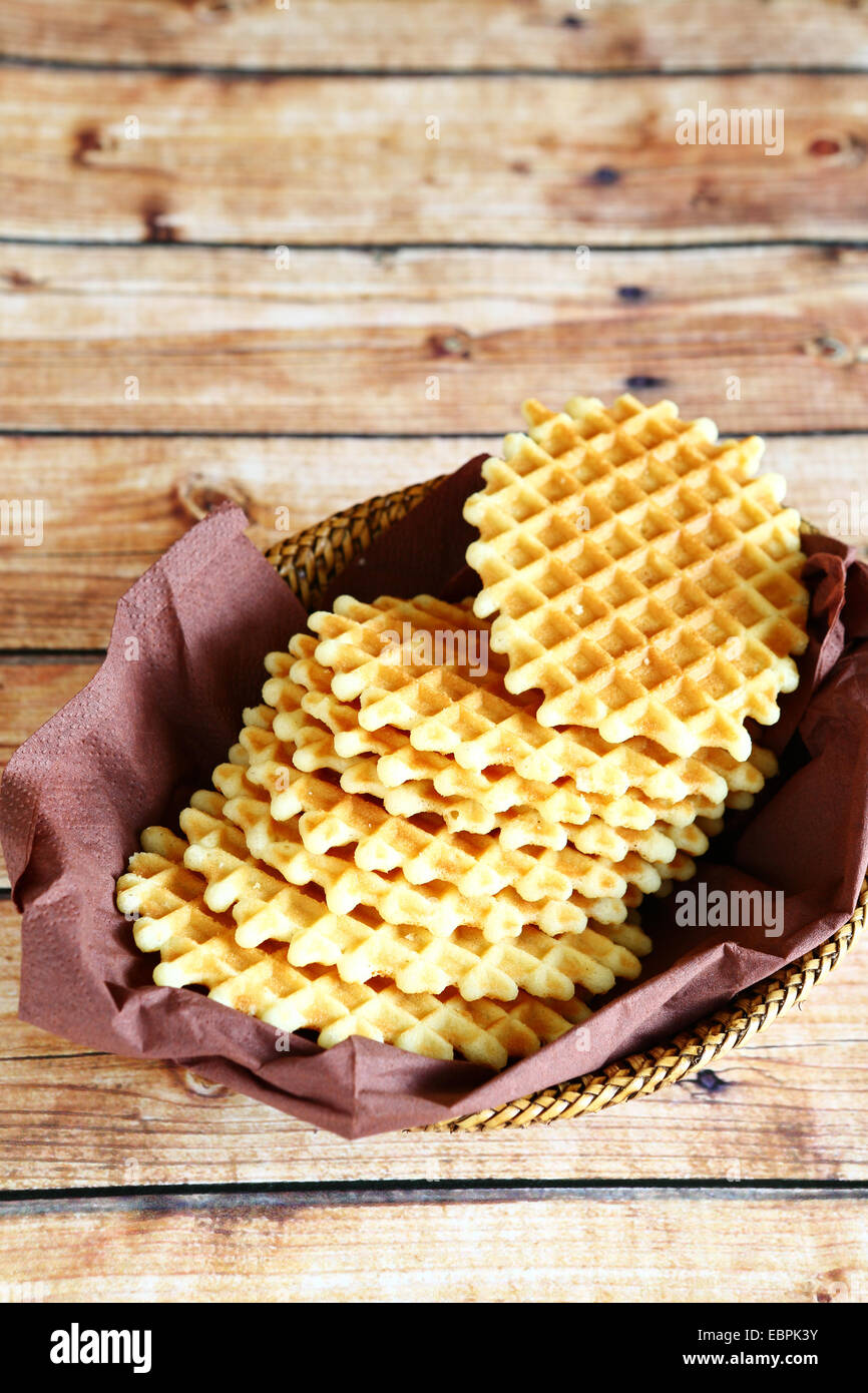 Crispy wafers on a napkin, wooden background Stock Photo - Alamy