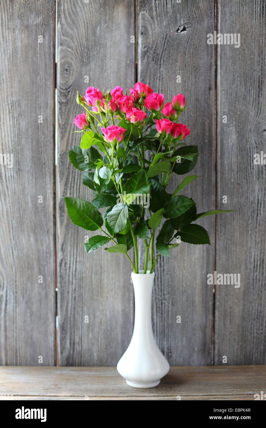 Small roses in a vase, bouquet Stock Photo - Alamy