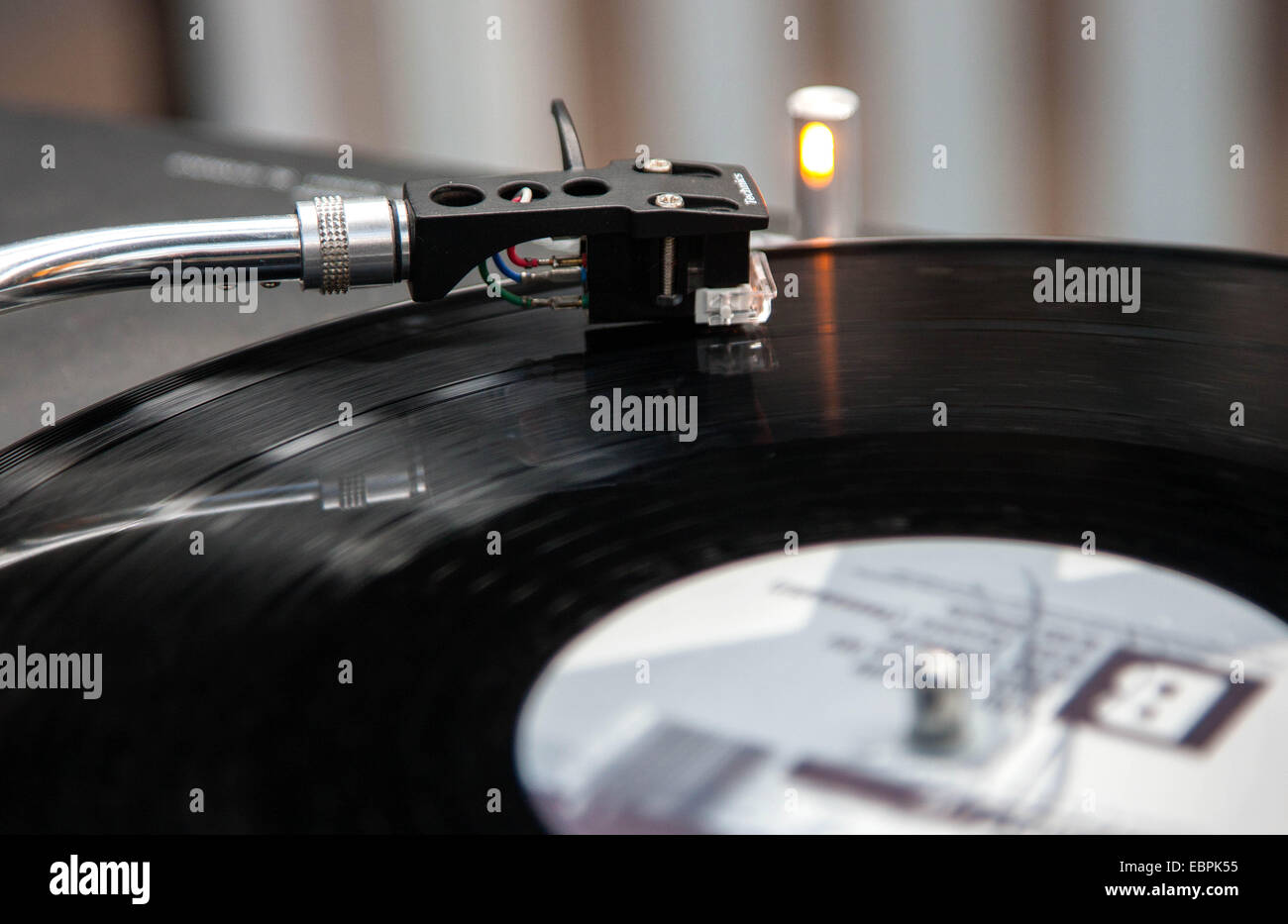 A modern vinyl record player deck playing music Stock Photo - Alamy