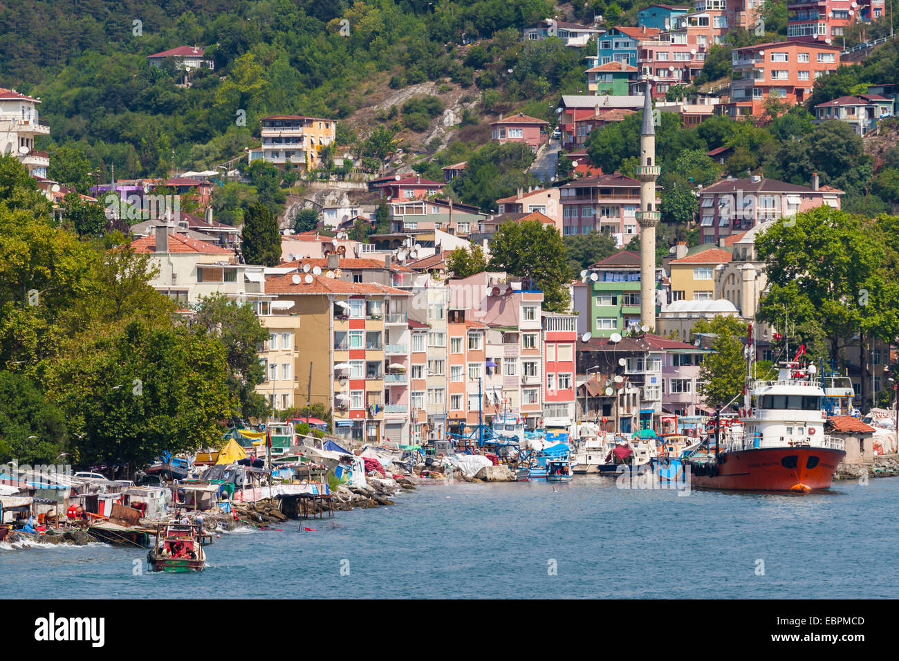 Fishermen and fishing boats, minaret and apartments, Rumeli Kavagi ...