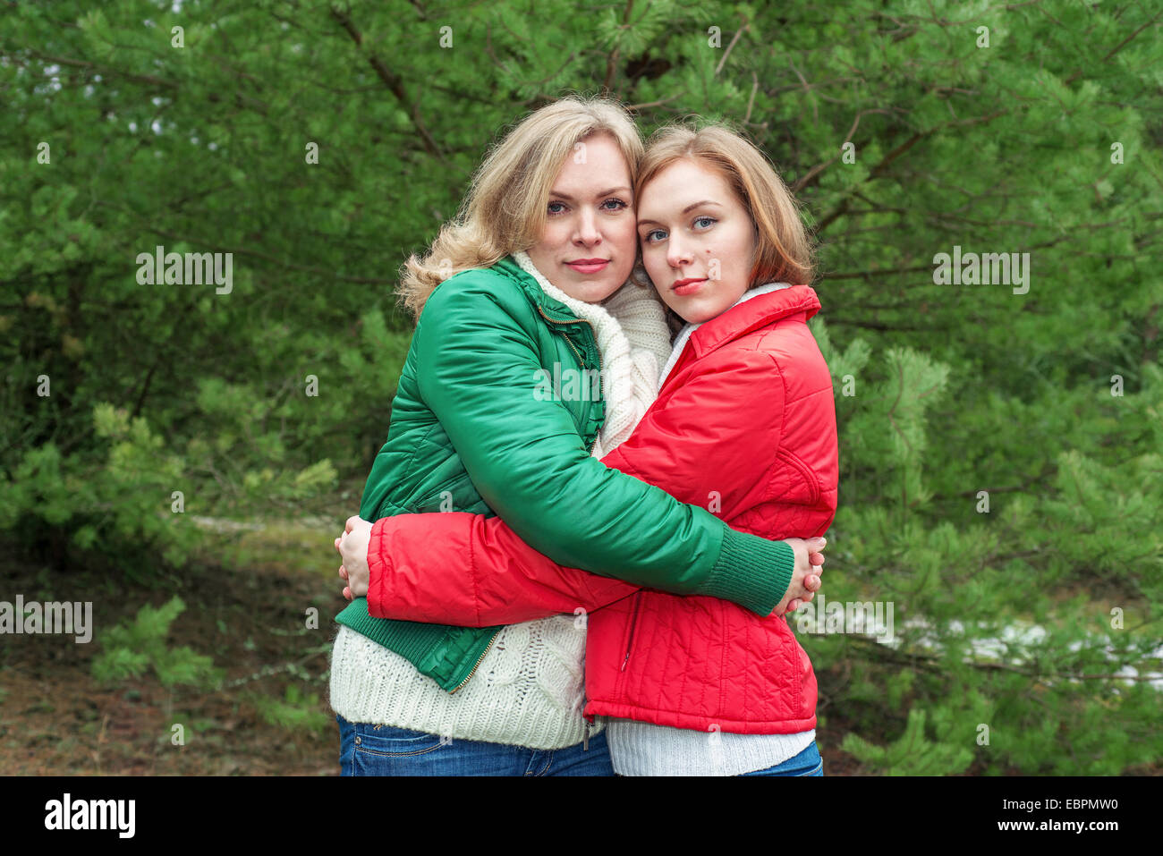 Two women are embracing Stock Photo - Alamy