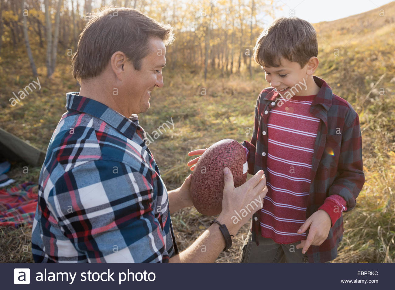 Father teaching son football hi-res stock photography and images - Alamy