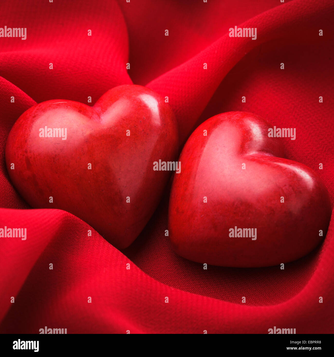 Two red hearts Stock Photo - Alamy