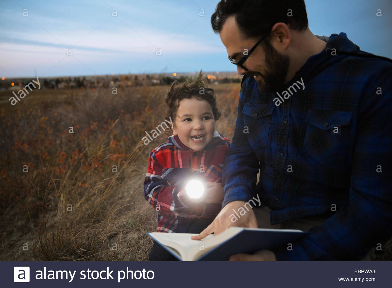 Child looking at flashlight hi-res stock photography and images - Alamy