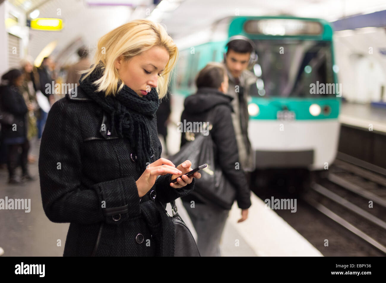 Woman on a subway station Stock Photo - Alamy