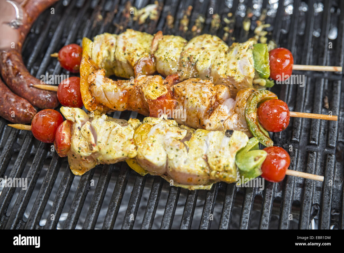 chicken kebabs and barbequed merguez with tomatoes Stock Photo - Alamy