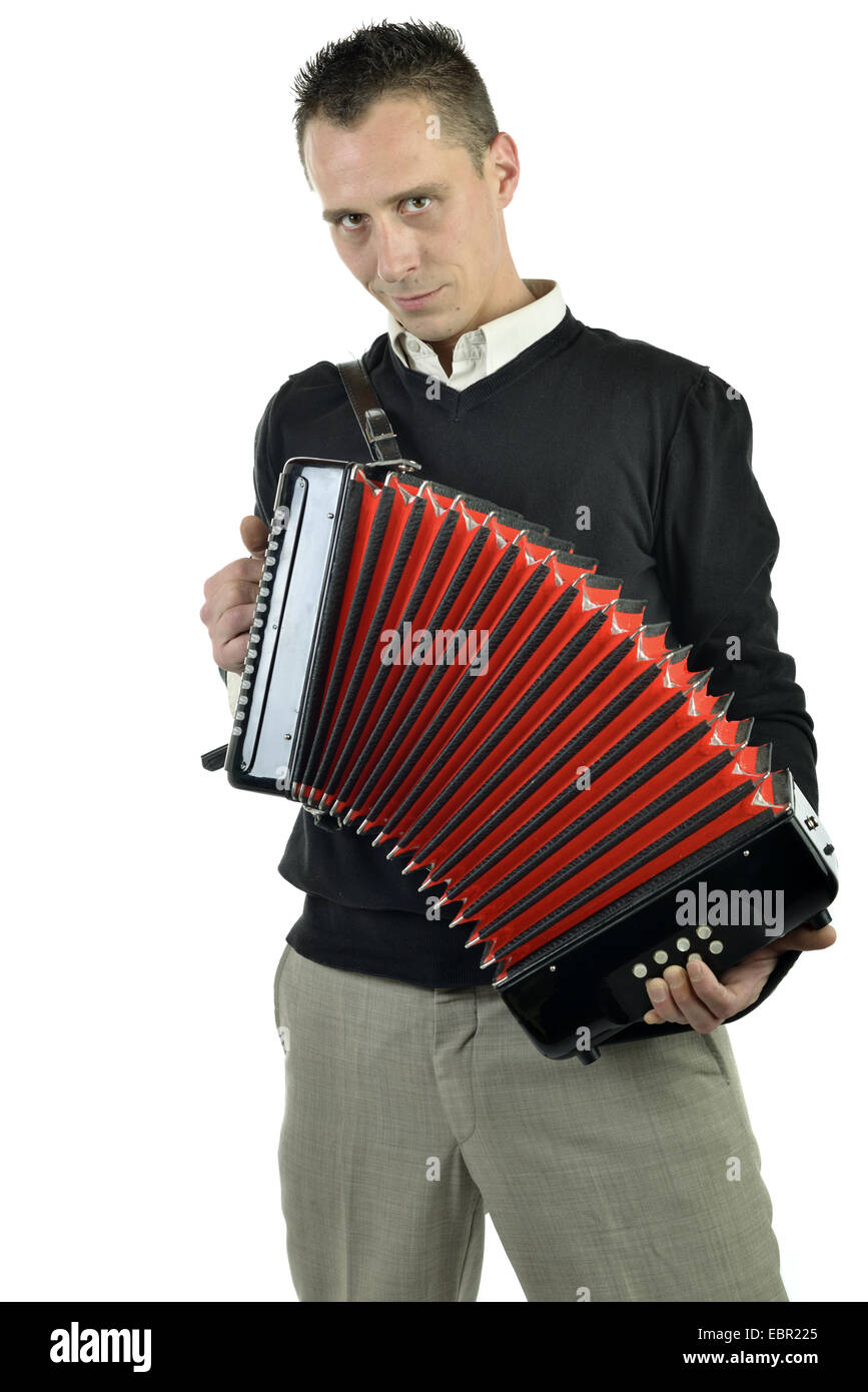 young man playing accordion on white background Stock Photo - Alamy