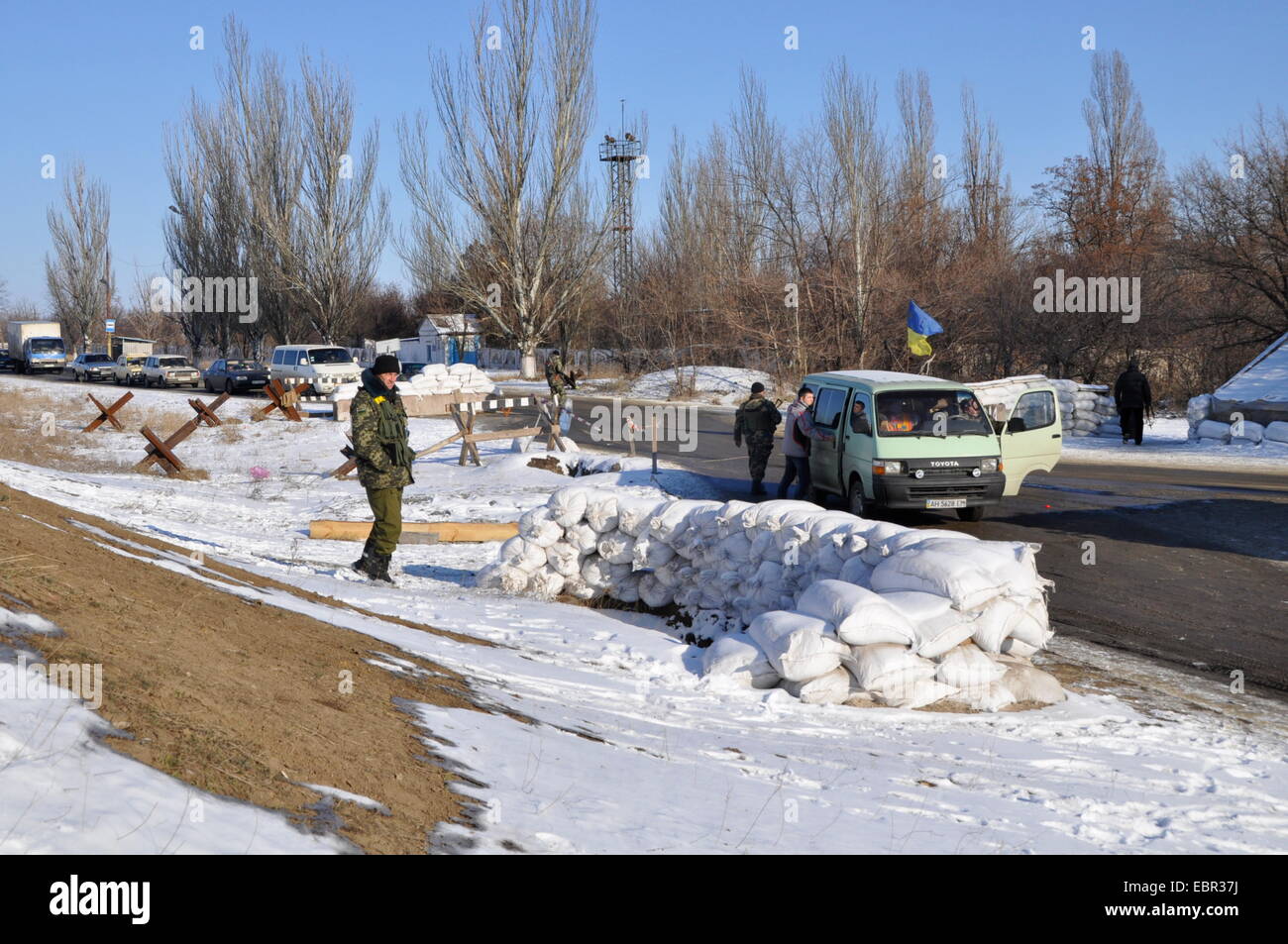 Ukrainian soldiers guard one of many checkpoints in Ukrainian town ...