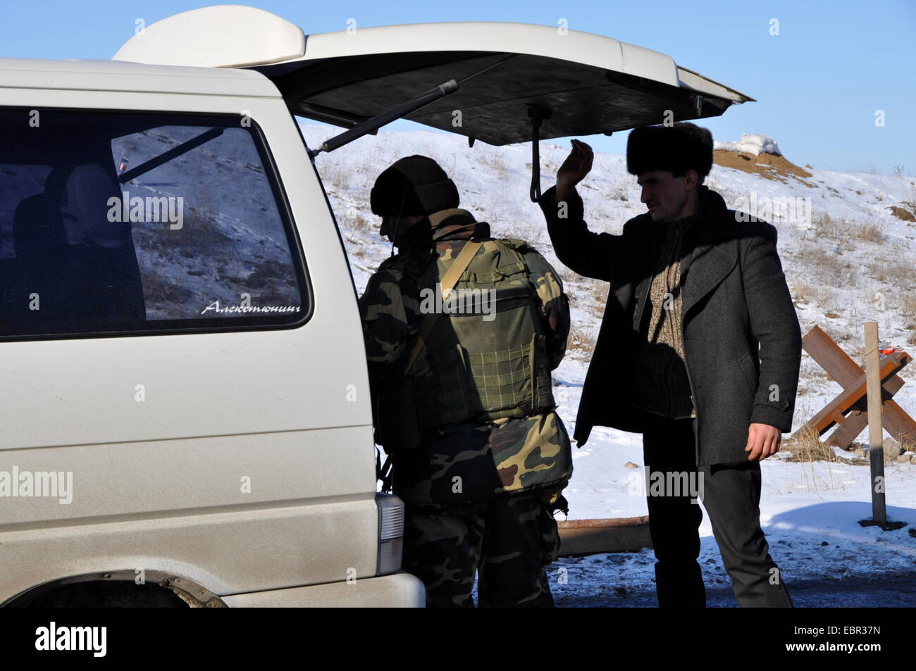 Ukrainian soldiers guard one of many checkpoints in Ukrainian town ...