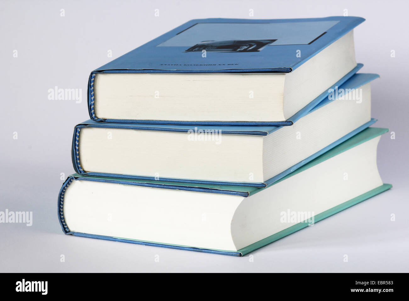 blue textbooks on a white background Stock Photo - Alamy