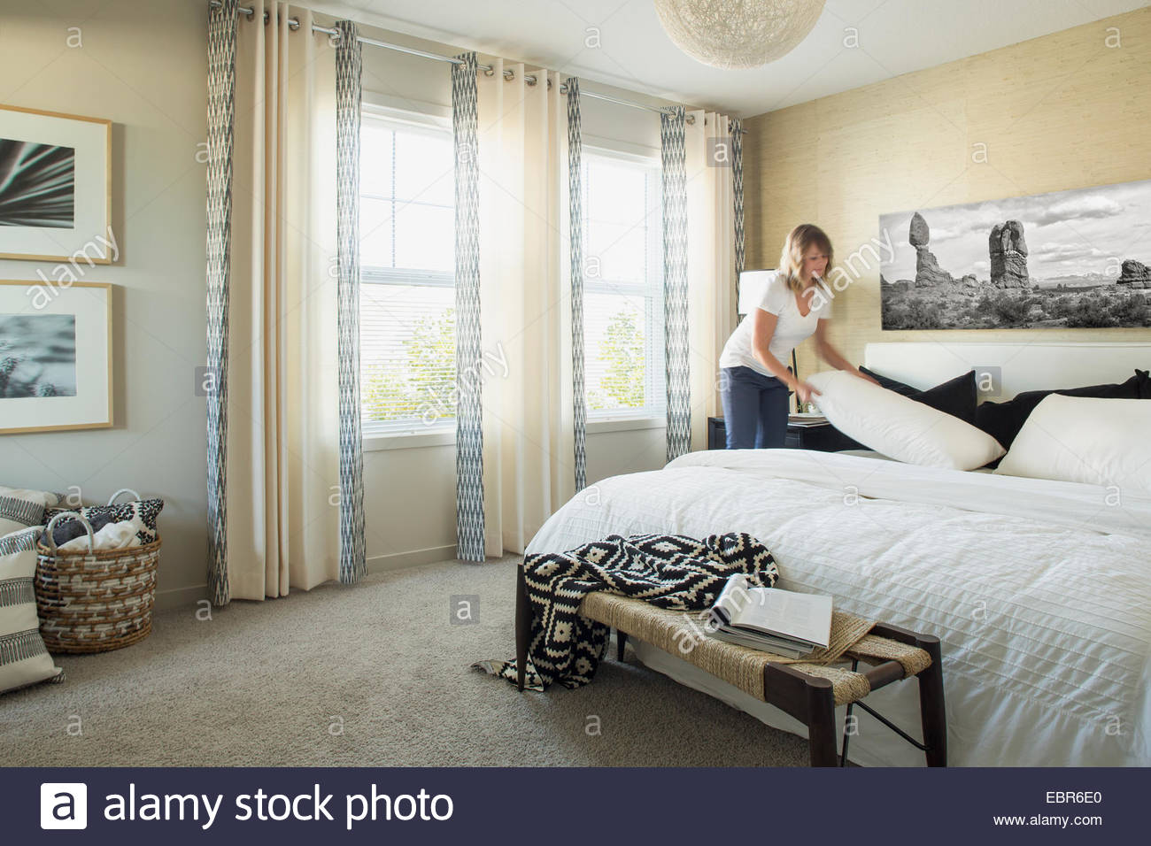 Blonde woman making bed hi-res stock photography and images - Alamy
