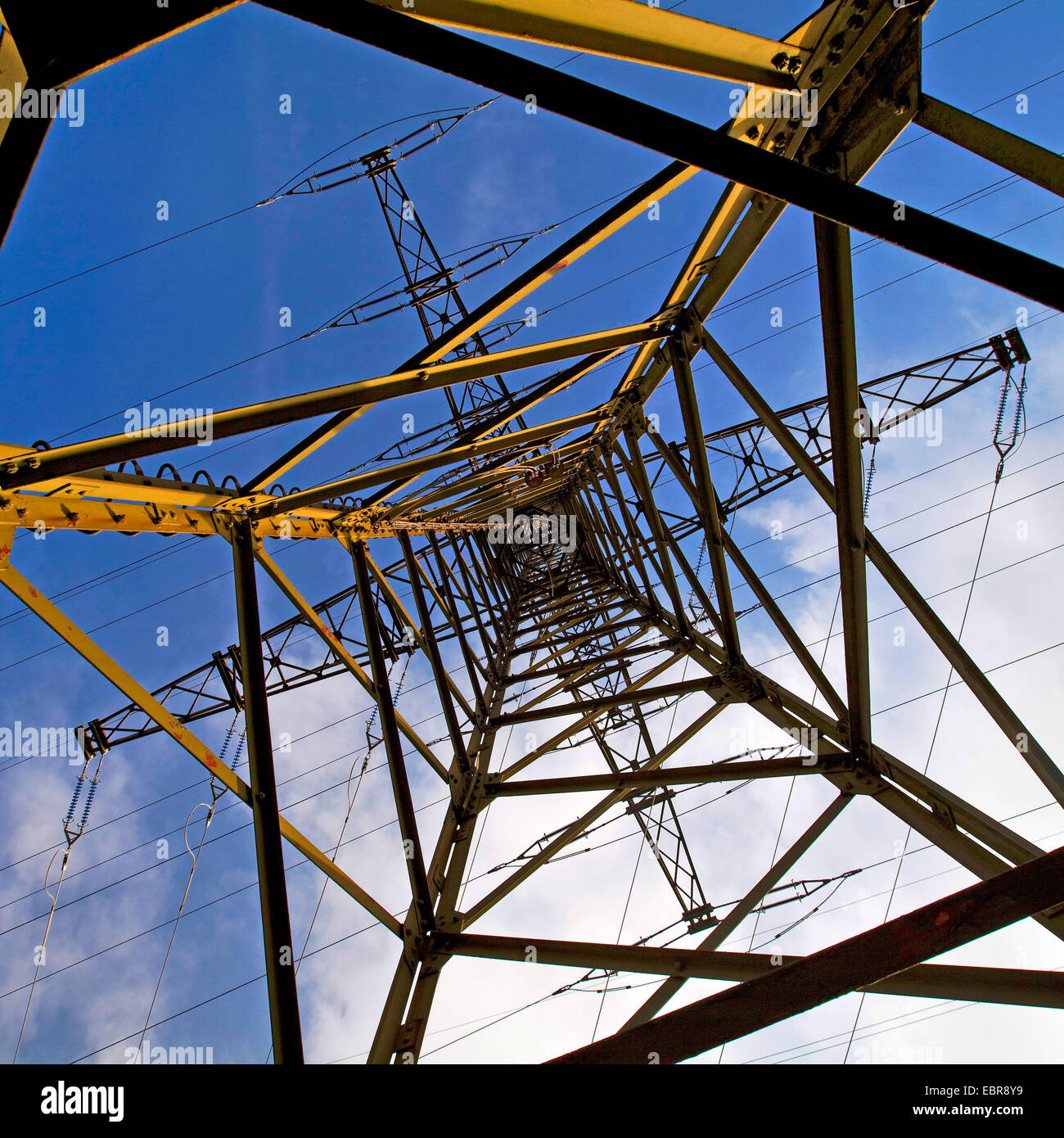 power pole from below with high voltage power lines, Germany, North ...