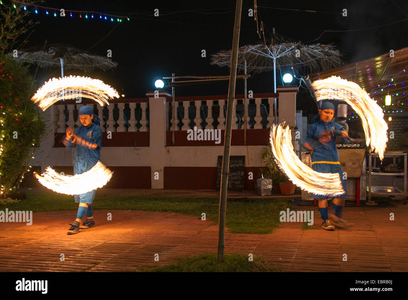 Tibetan fire dancers performing in gardens of a hotel in Goa for ...