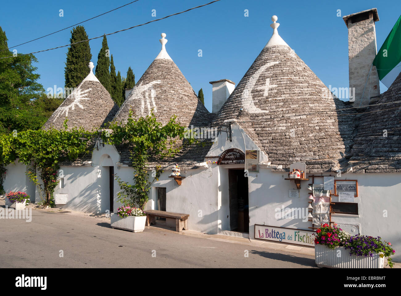 Row of Trullo Houses in Monte Pertica Street, Alberobello Trulli ...