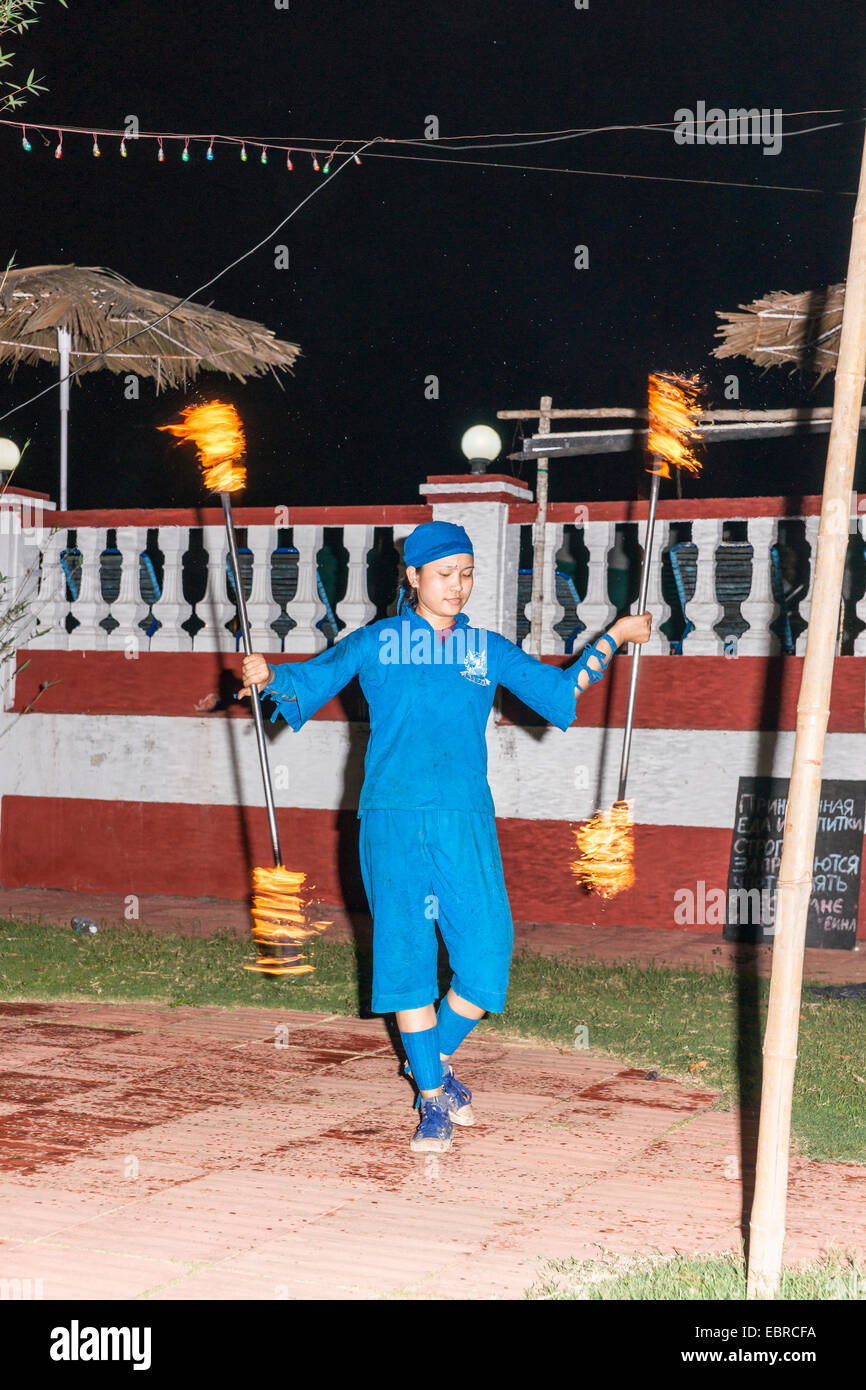 Tibetan fire dancers performing in gardens of a hotel in Goa for ...