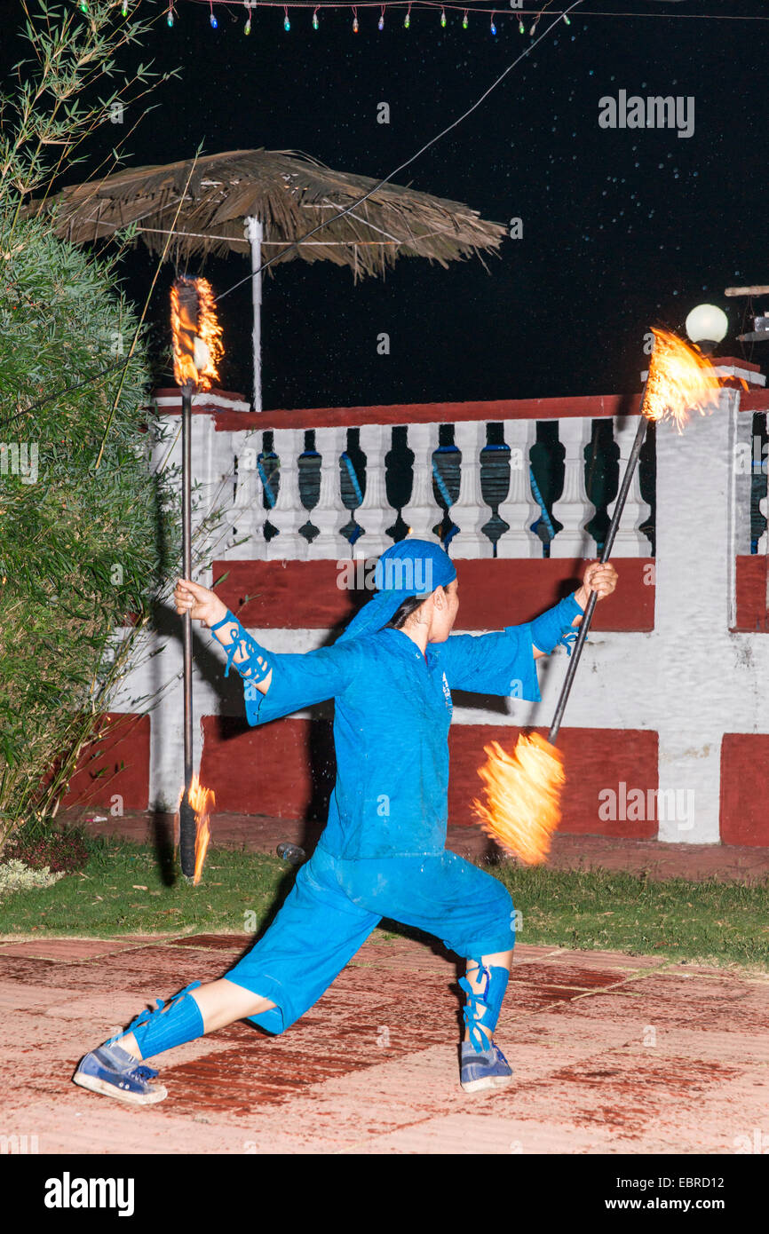 Tibetan fire dancers performing in gardens of a hotel in Goa for ...