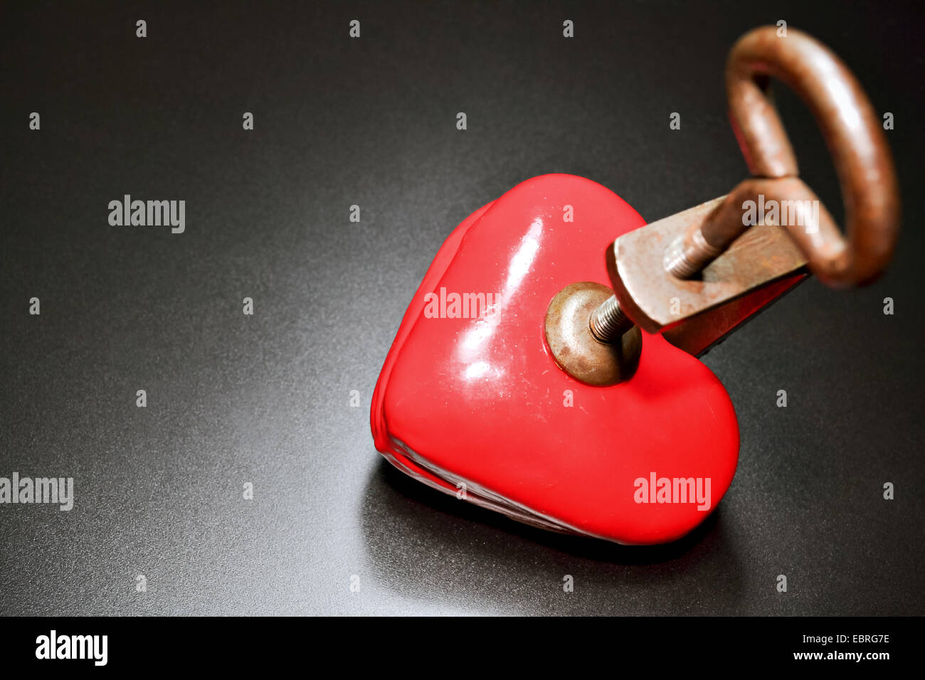 Metaphorical expression of squashed heart on a black background Stock ...