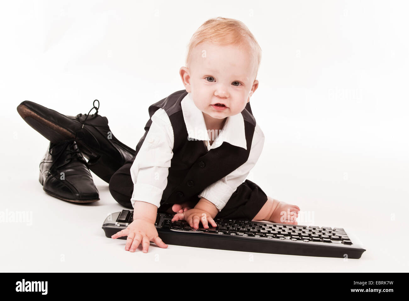little child with computer keyboard Stock Photo - Alamy