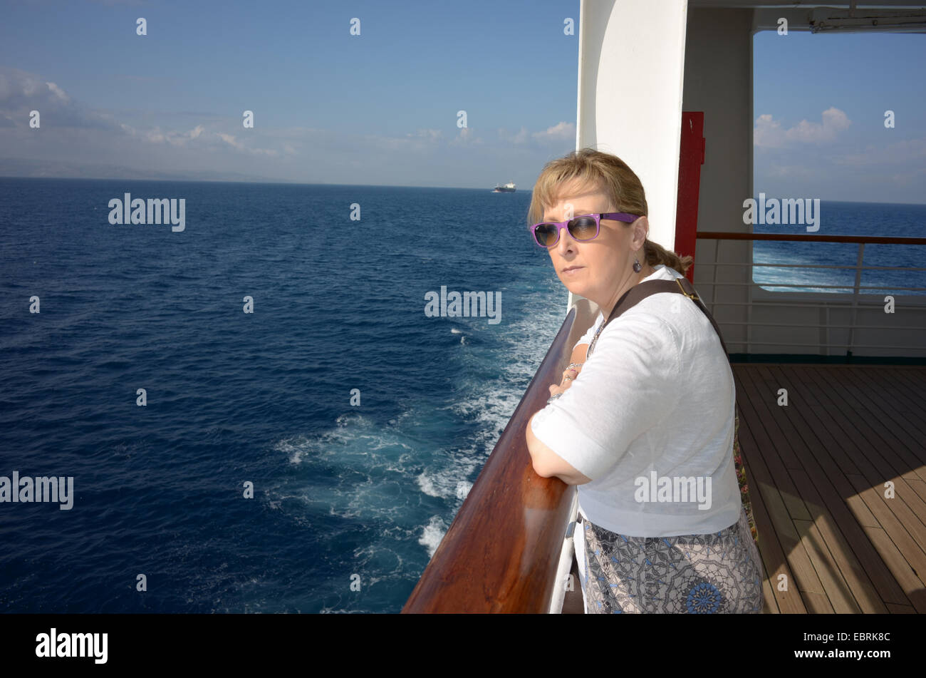 Woman looks out sea hi-res stock photography and images - Alamy
