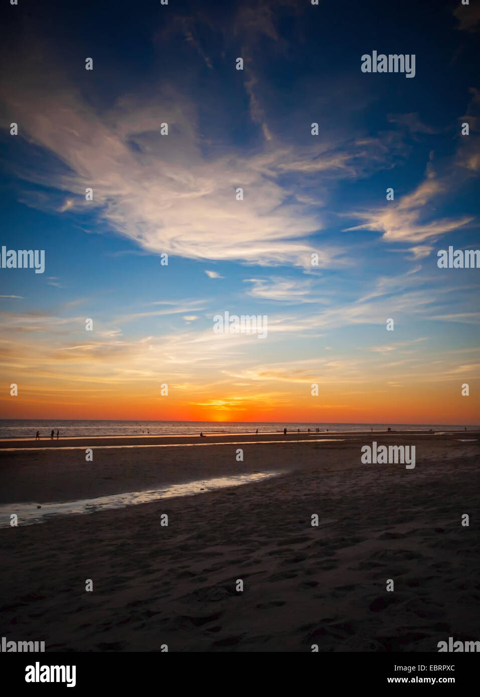 sunset on the beach Stock Photo - Alamy