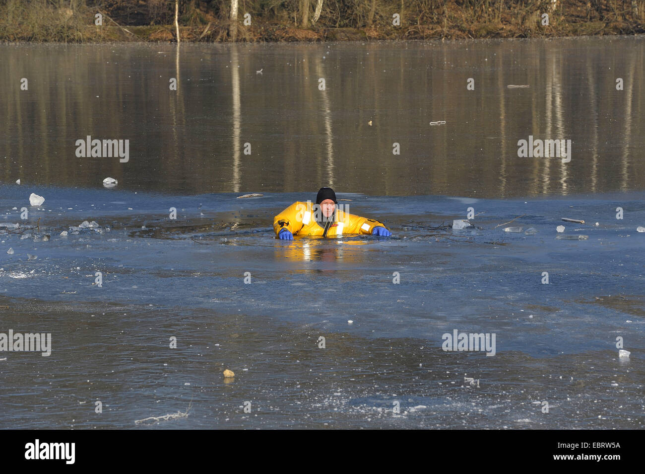 firefighers practising rescue on frozen lake, Germany Stock Photo - Alamy