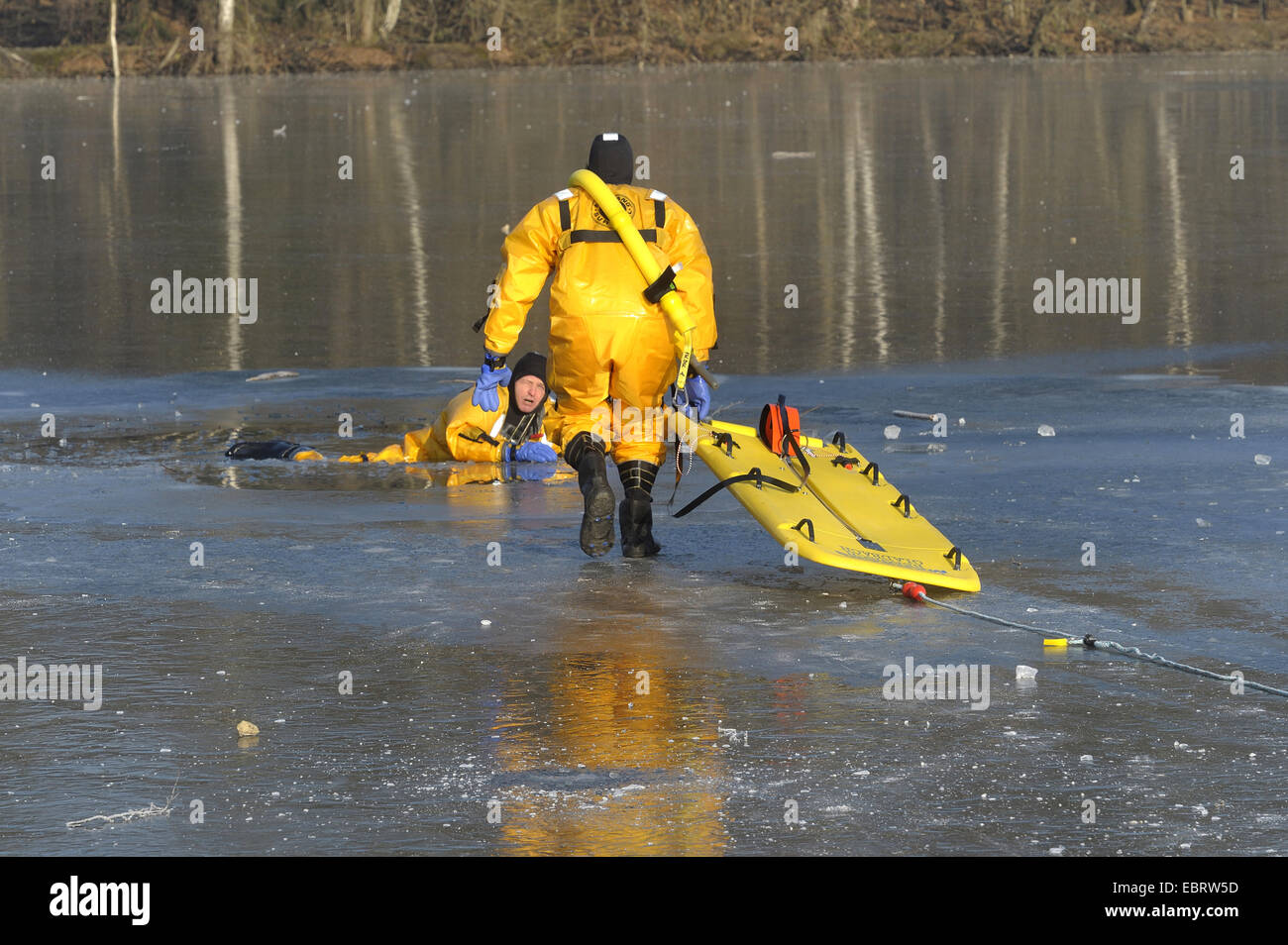 firefighers practising rescue on frozen lake, Germany Stock Photo - Alamy